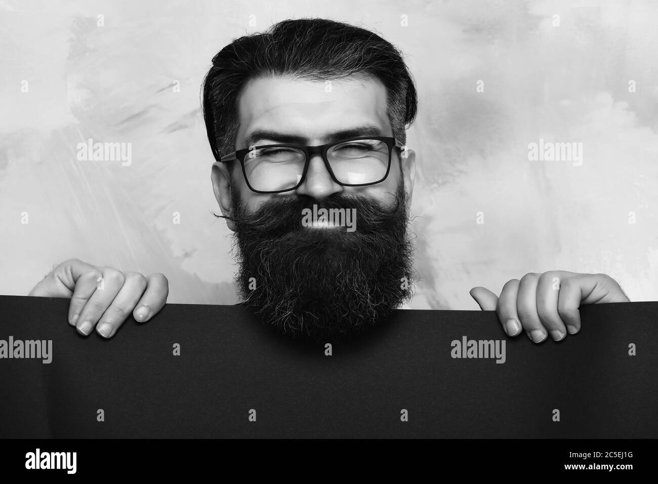 Bearded man, long beard. Brutal caucasian unshaven squinting hipster ...