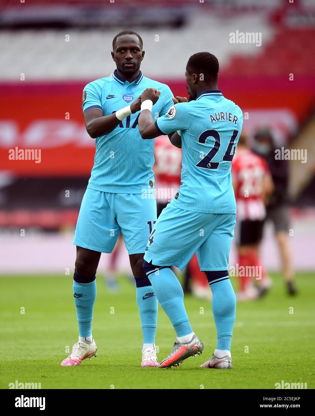 Tottenham Hotspur's Moussa Sissoko (left) and Serge Aurier fist bump before the Premier League ...