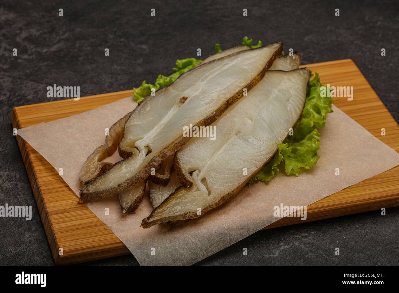 Delicous smoked halibut fish slices snack Stock Photo - Alamy