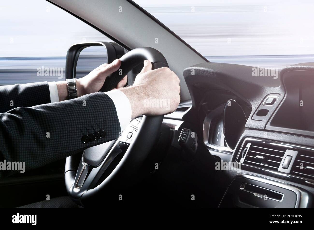 Business man driving his car Stock Photo - Alamy