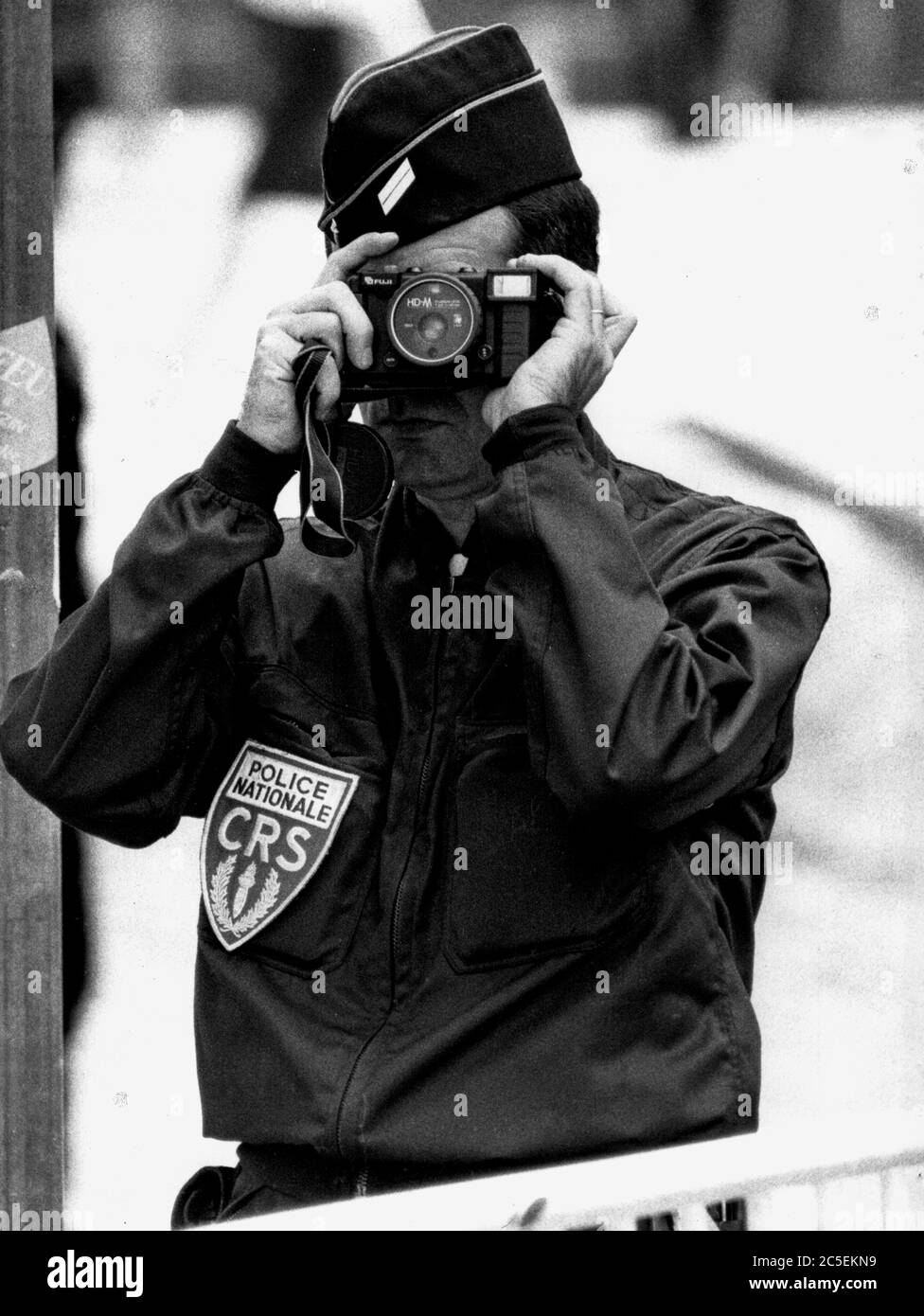 A French police officer taking photographs, Lyon, France Stock Photo ...