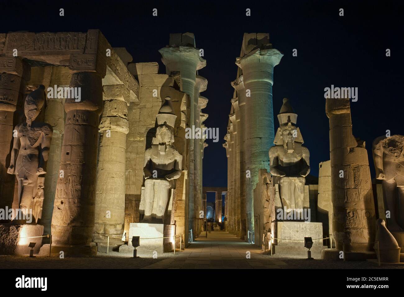 Large statues of Ramses II with columns in hypostyle hall at ancient ...
