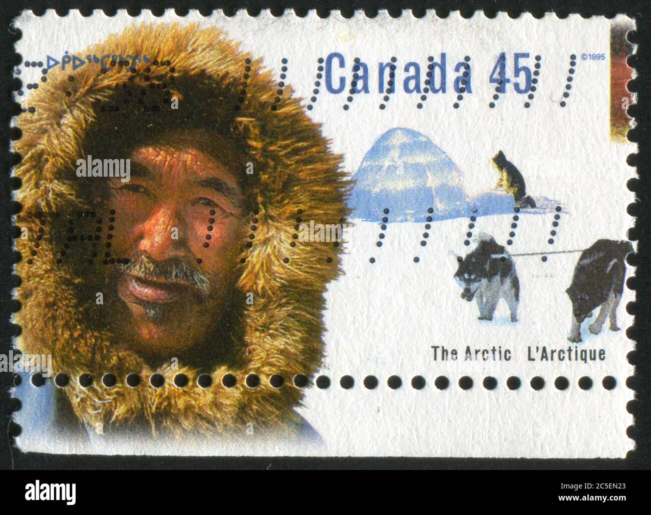 CANADA - CIRCA 1995: stamp printed by Canada, shows Inuk man, igloo ...