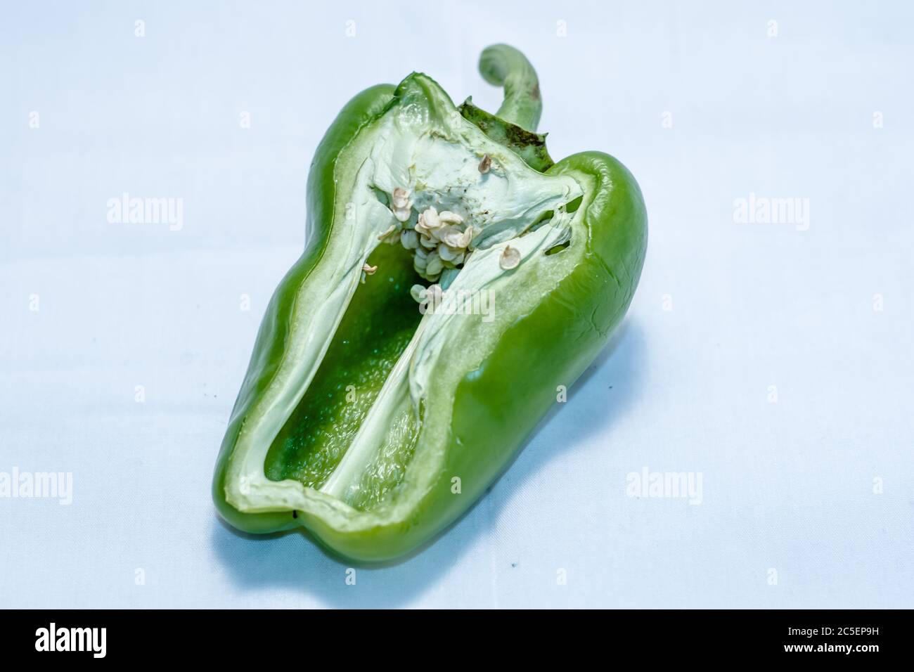 Half-cut sliced green bell pepper Stock Photo - Alamy
