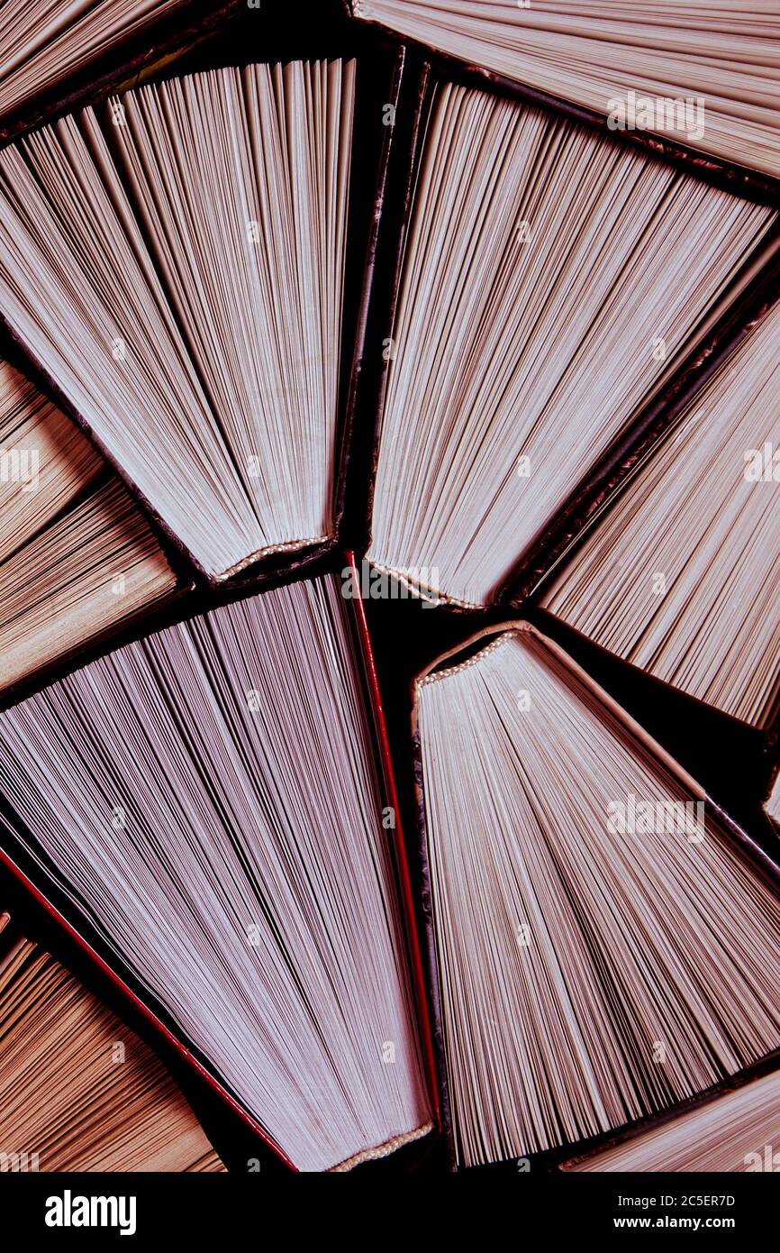 Colorful books ready to be read in the home library Stock Photo - Alamy