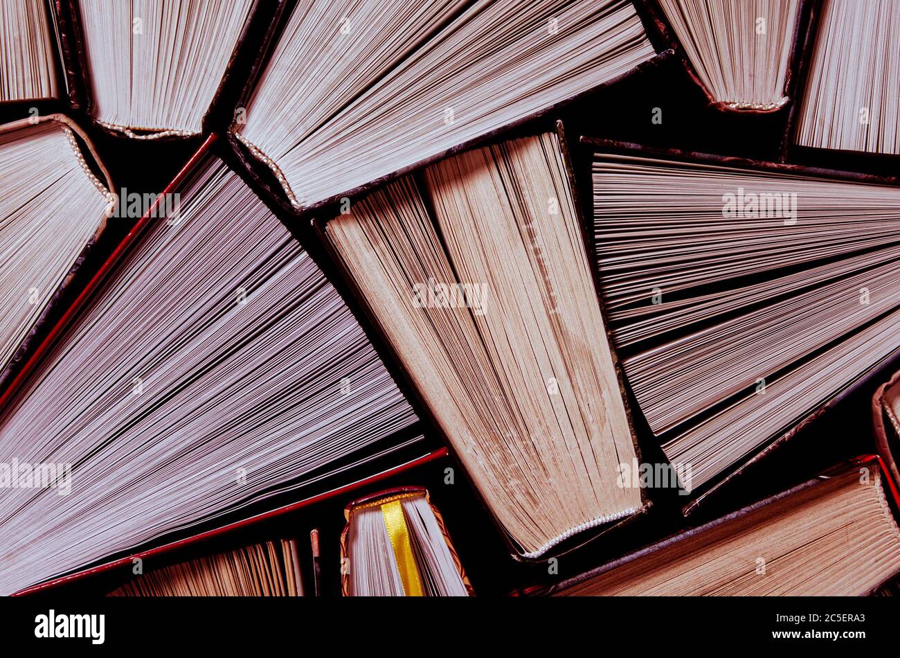 Colorful books ready to be read in the home library Stock Photo - Alamy