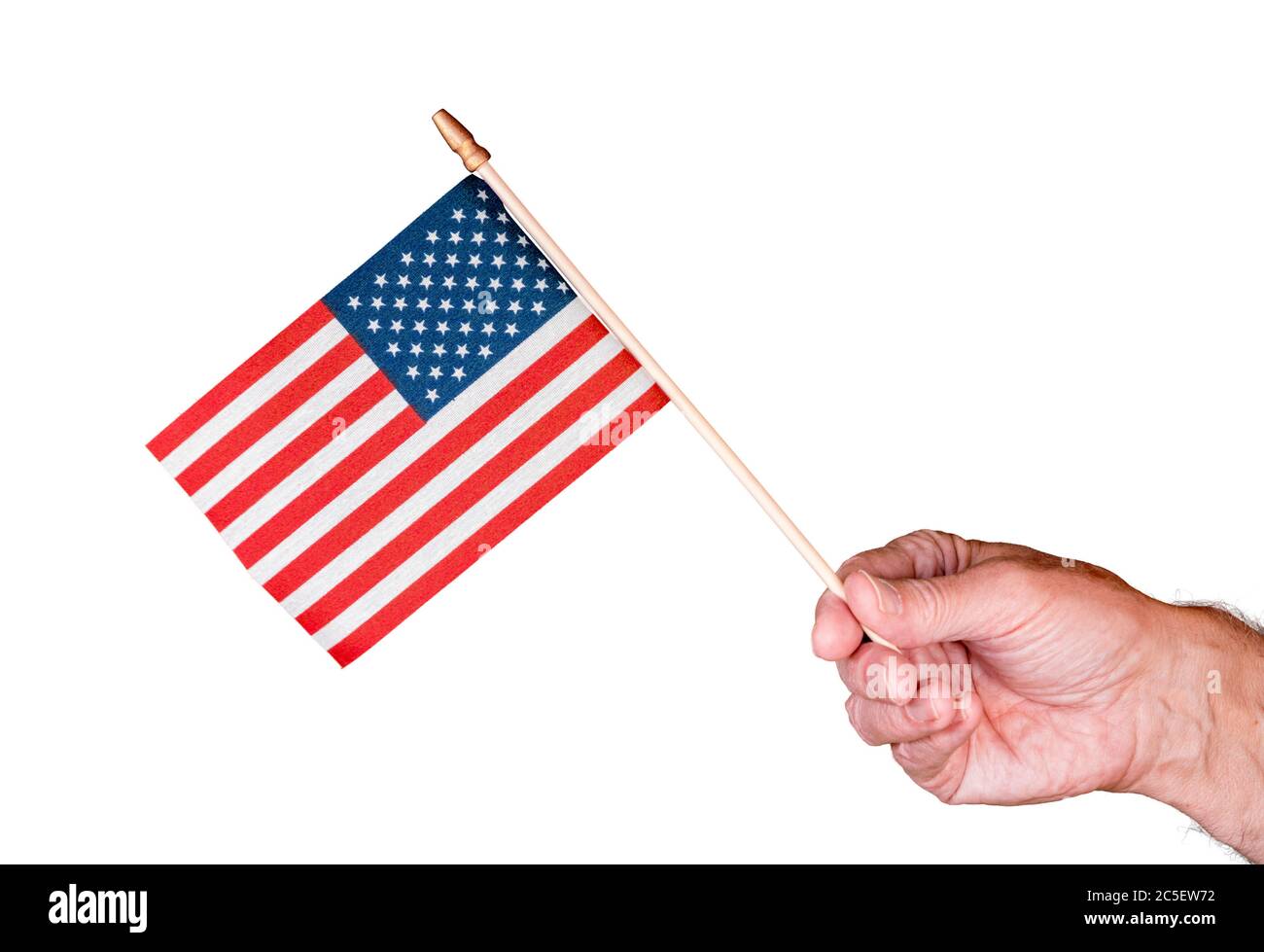 Senior mans hand holding a small toy USA flag and cutout against white ...