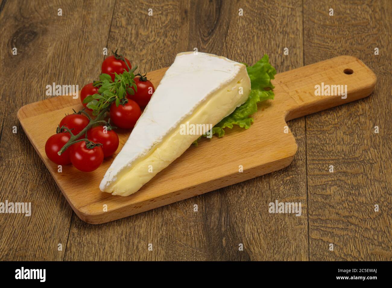 Brie cheese triangle served salad leaves Stock Photo - Alamy
