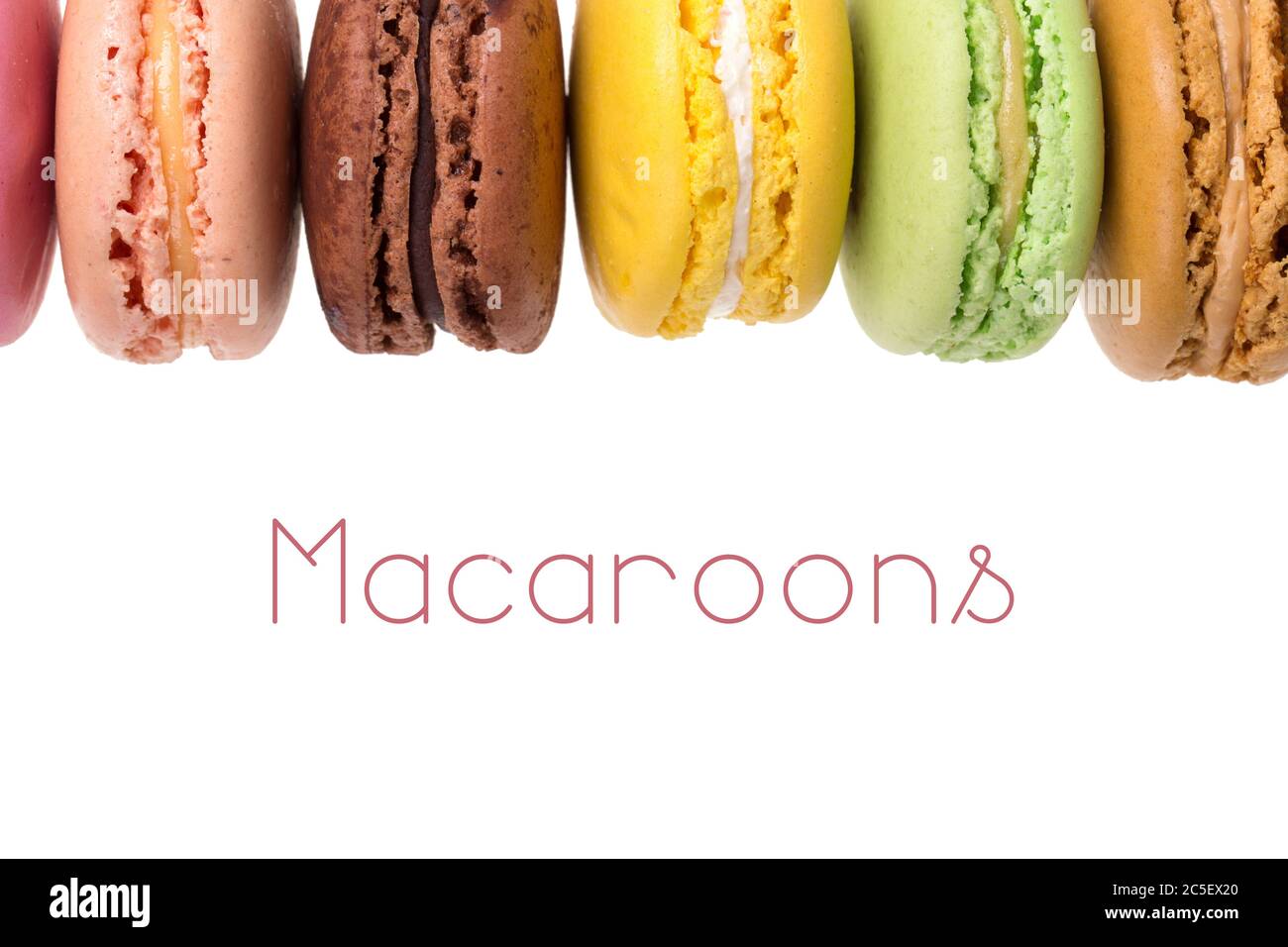 Closeup of a row of ccolourful French macaroons isolated on white ...