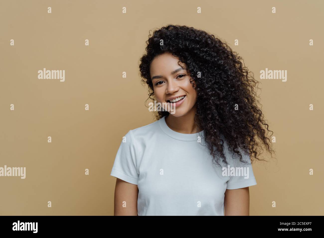 Woman with bushy hair hi-res stock photography and images - Alamy