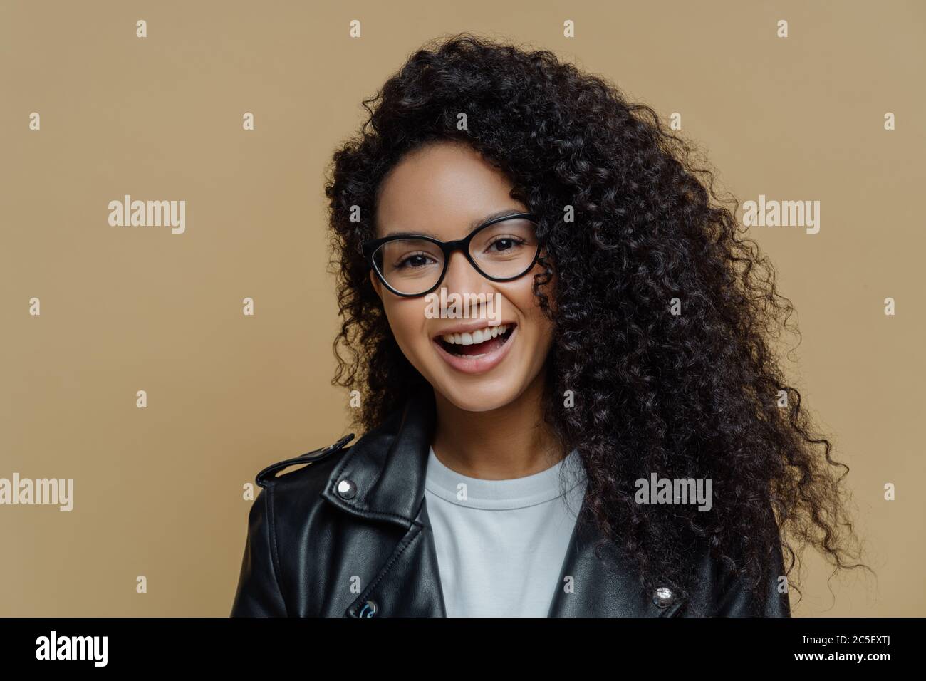 Indoor shot pleased curly hi-res stock photography and images - Alamy