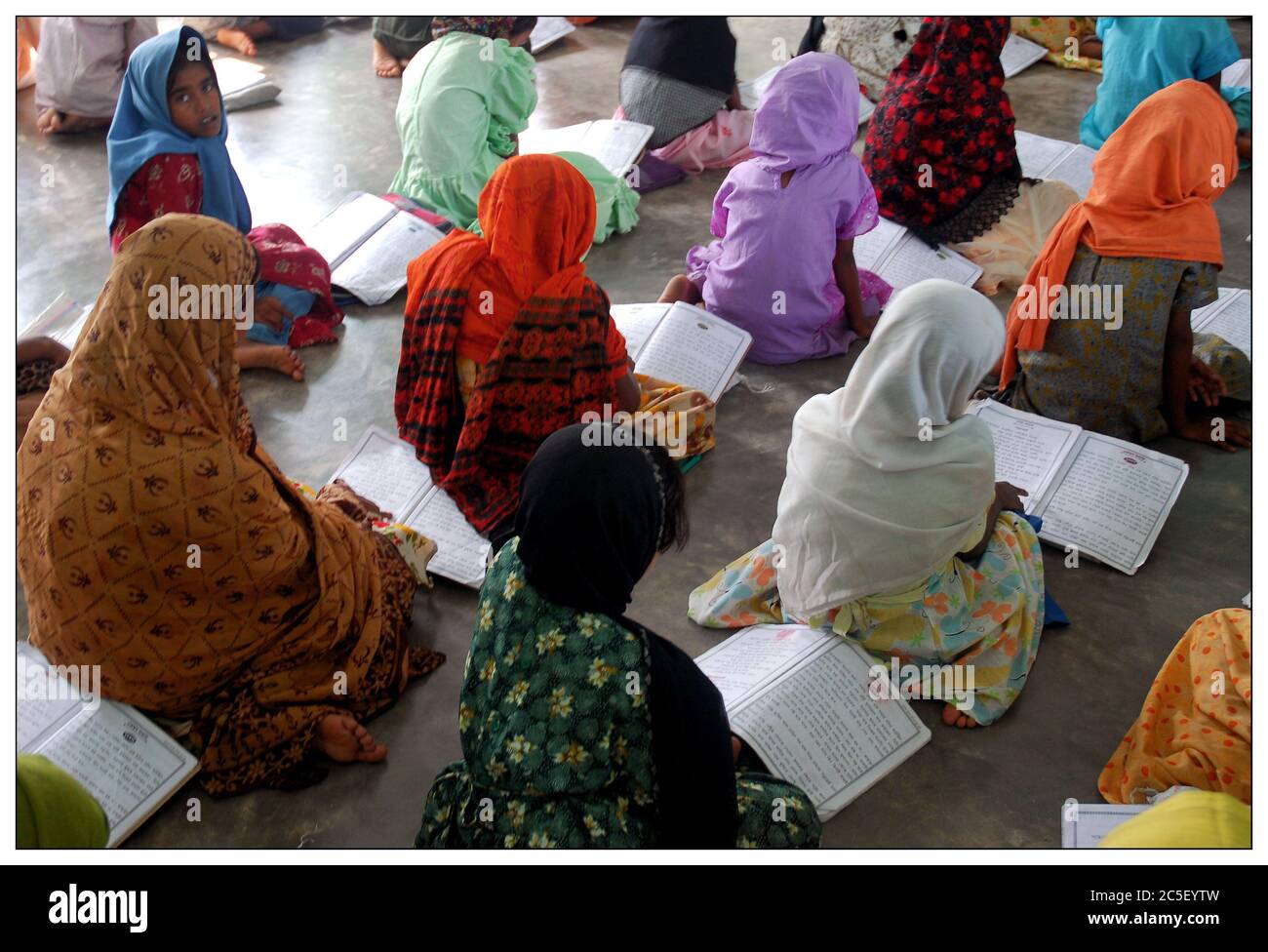 Muslim children learning lessons at a Madrasa (Islamic school) in ...