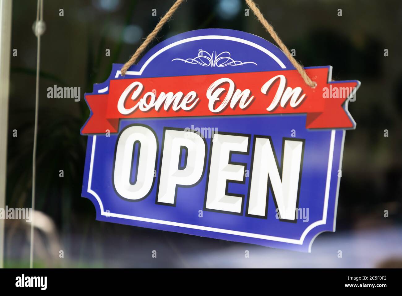 Storefront Open Sign Through Window Stock Photo - Alamy