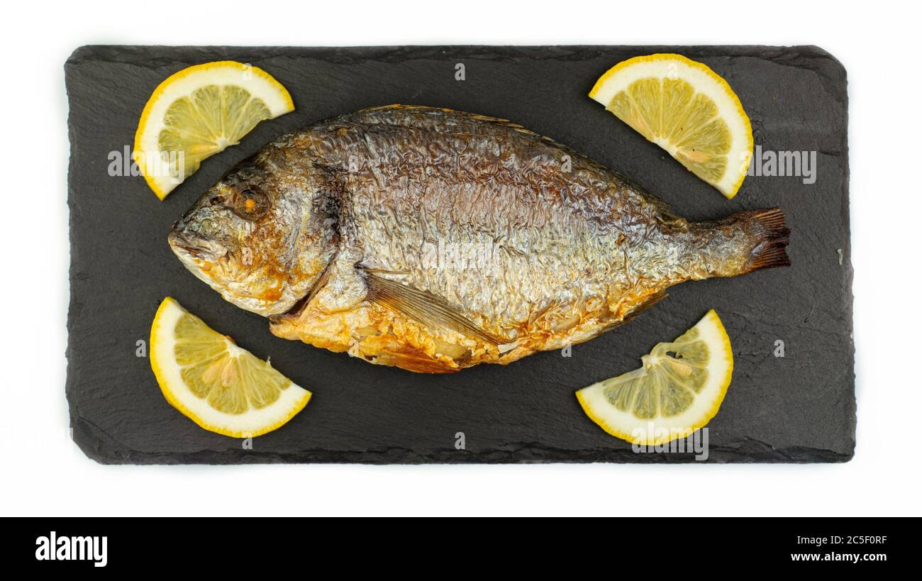 Roasted fish dorado Cut Out Stock Images & Pictures - Alamy
