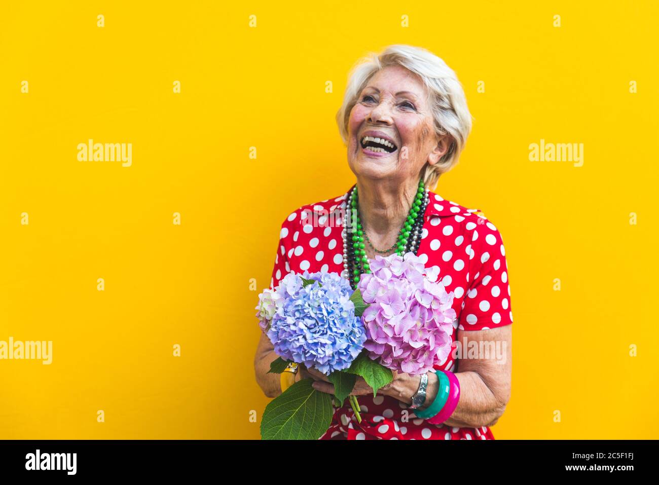 Happy And Playful Senior Woman Having Fun Portrait Of A Beautiful