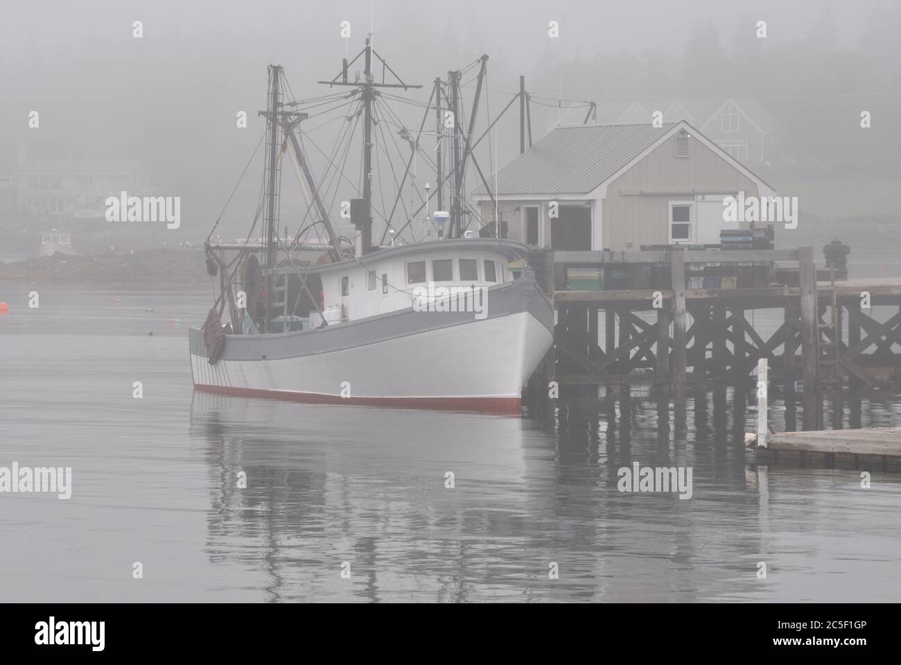 Calm, restful scene in coastal Maine. Fishing trawler anchored ...