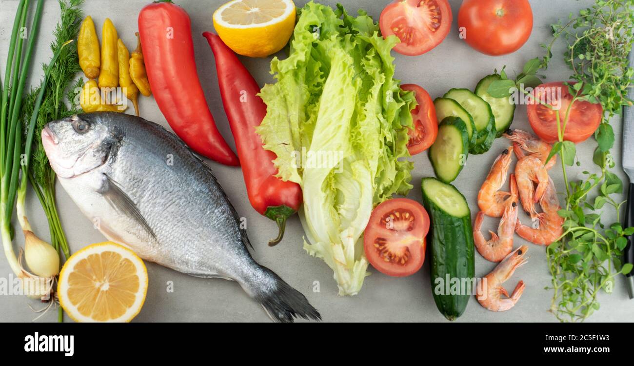 fresh fish with vegwtable for grill flat lay menu Stock Photo - Alamy