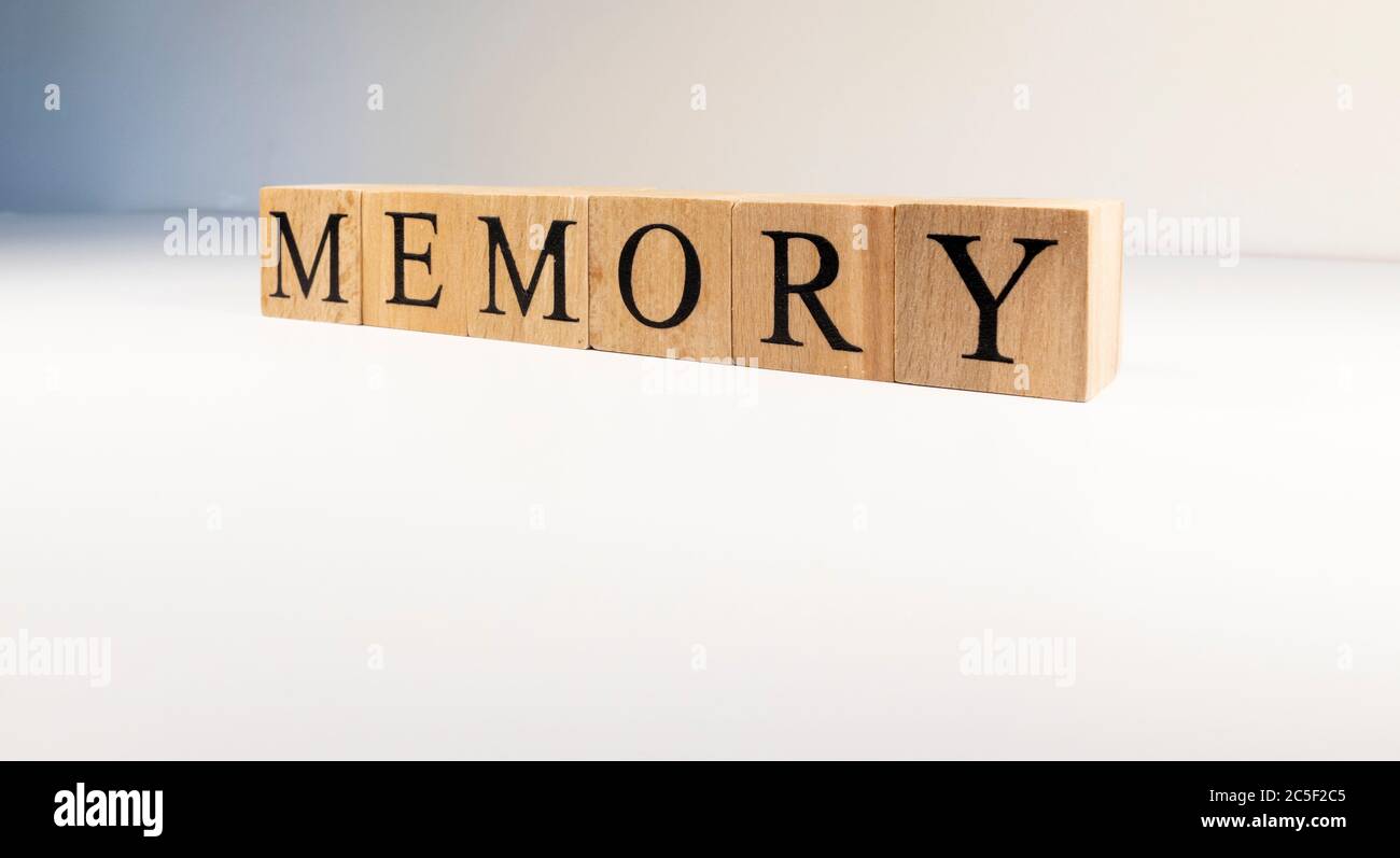 Memory text from wooden cubes. Photo was taken in white background ...