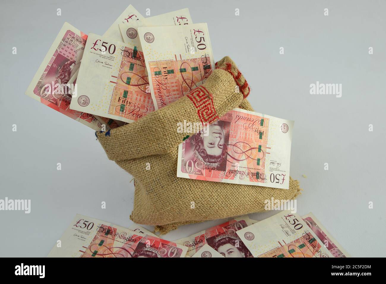 British money Fifty pound note in a Sack , on white background ...