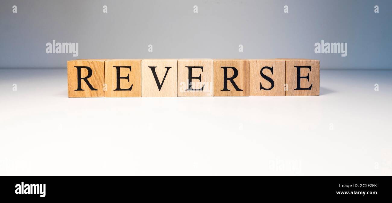Reverse text from wooden cubes. Photo was taken in white background ...