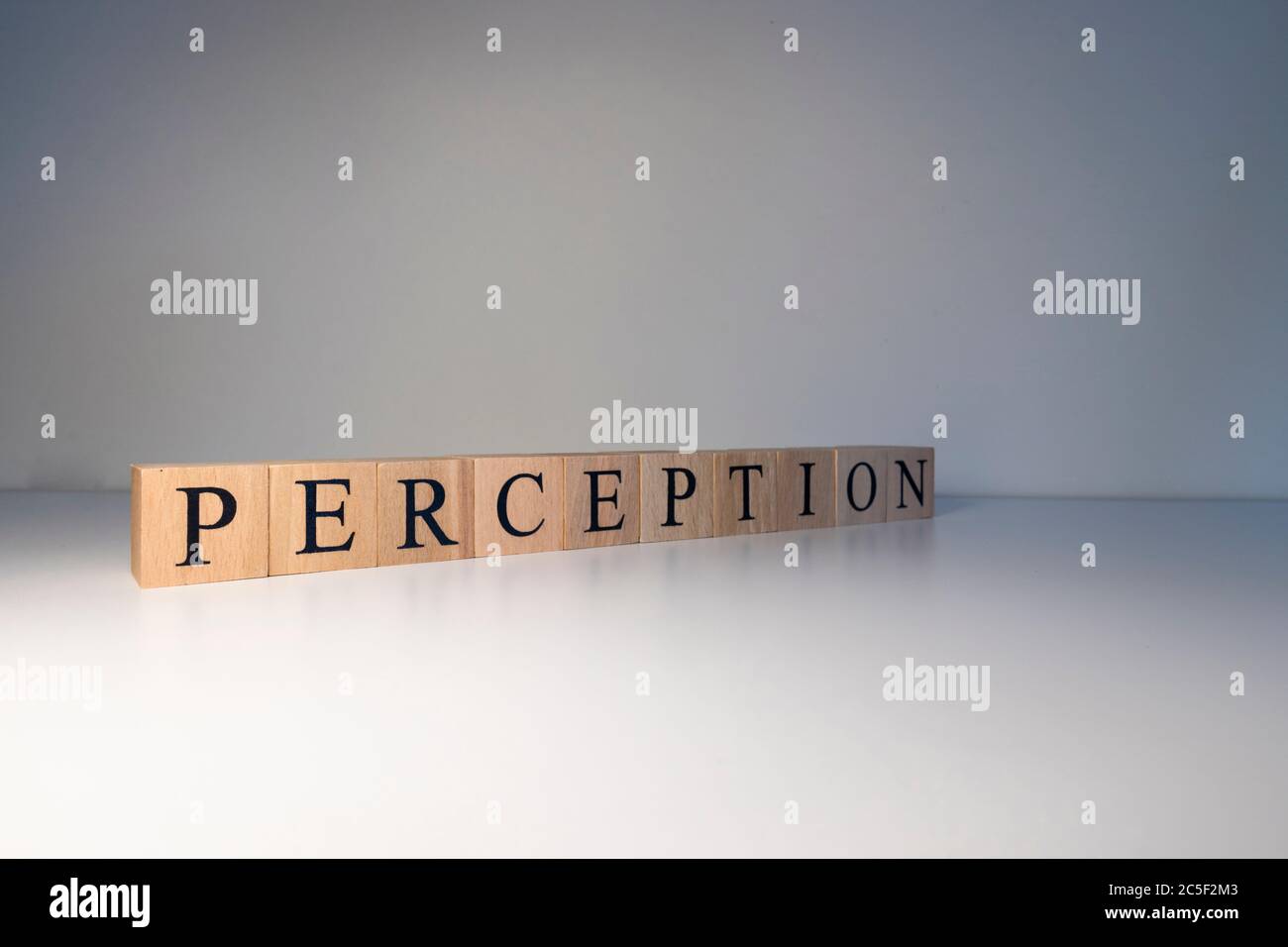 Perception text from wooden cubes. Photo was taken in a white ...