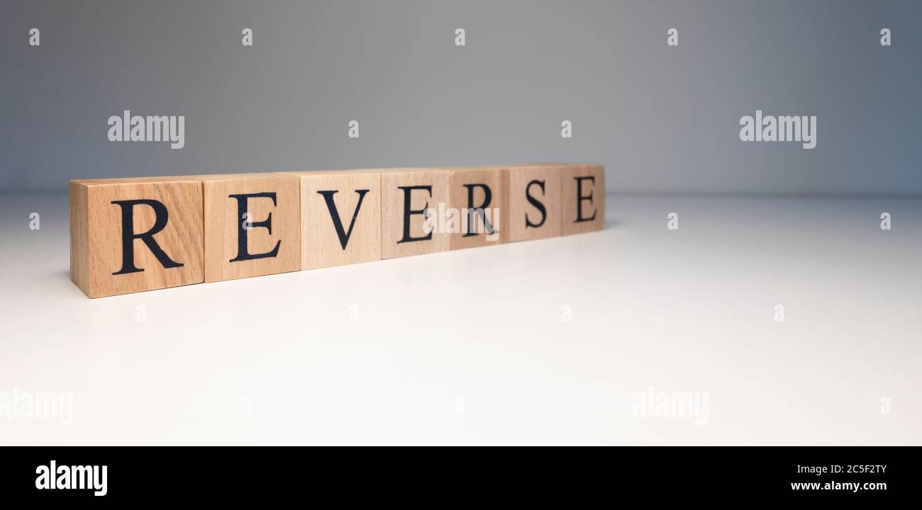 Reverse text from wooden cubes. Photo was taken in white background ...