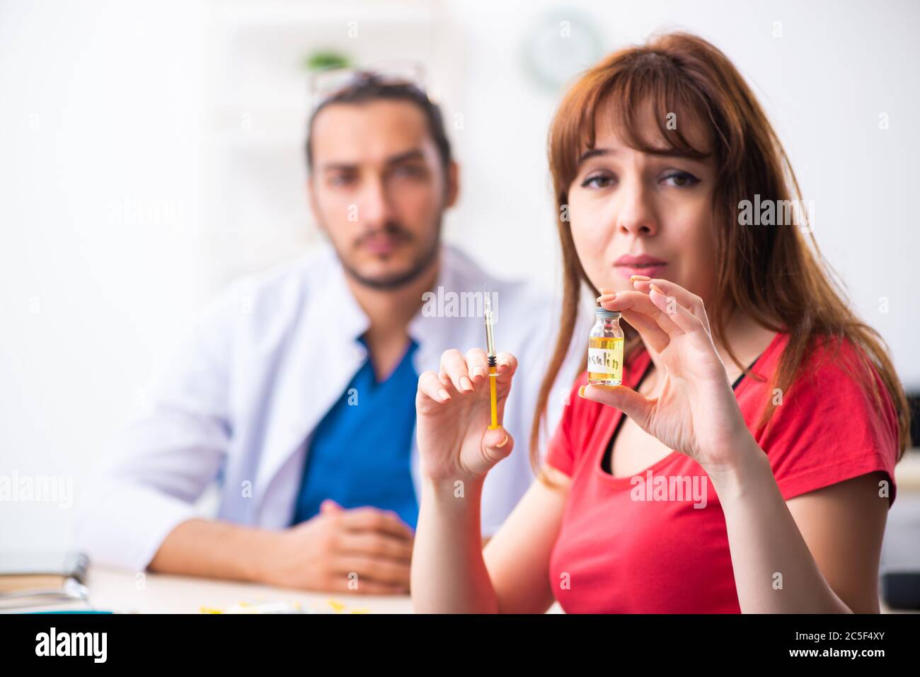 Female diabetic patient visiting young doctor Stock Photo - Alamy