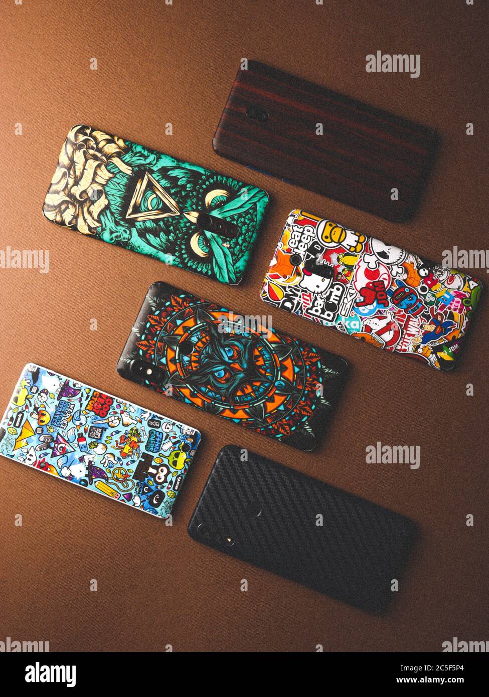 custom phone skin flatlay with different background colour Stock Photo ...