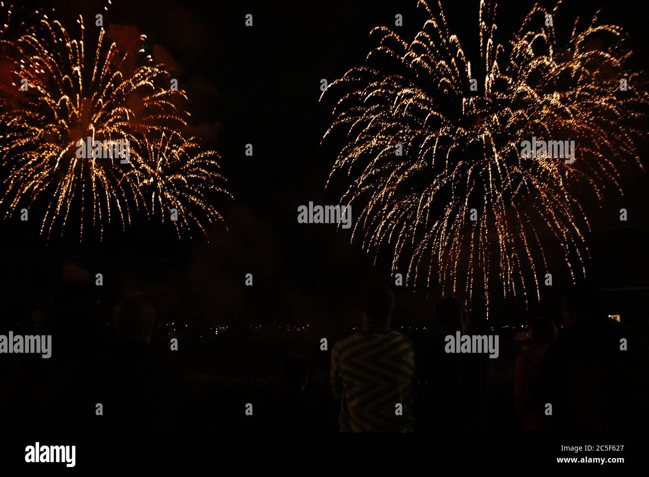 People watch the fireworks. Fourth of July Fireworks. Fireworks light ...