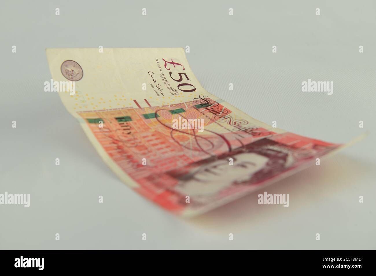 British money Fifty pound note on a white background Stock Photo - Alamy