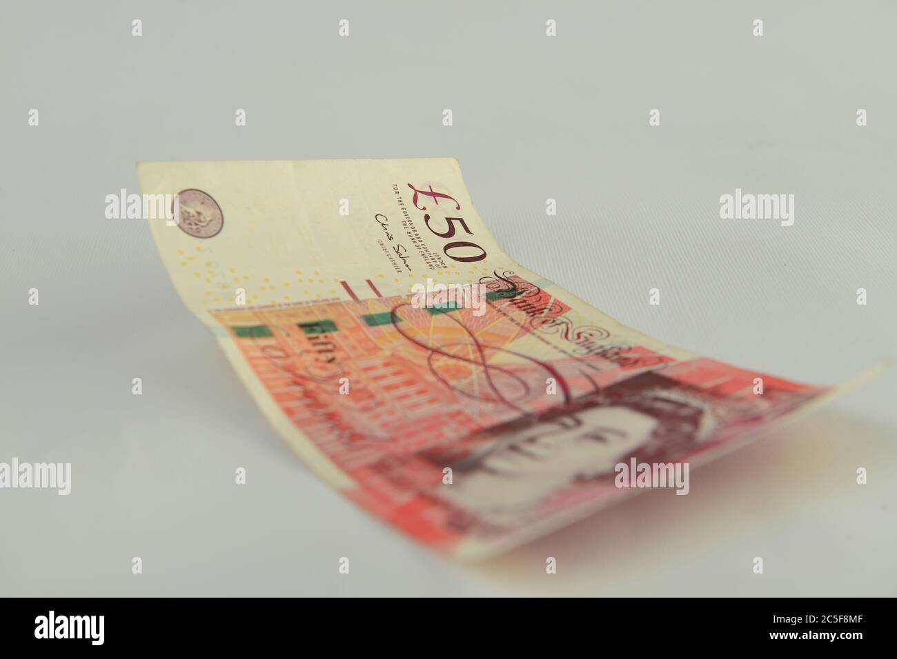 British money Fifty pound note on a white background Stock Photo - Alamy