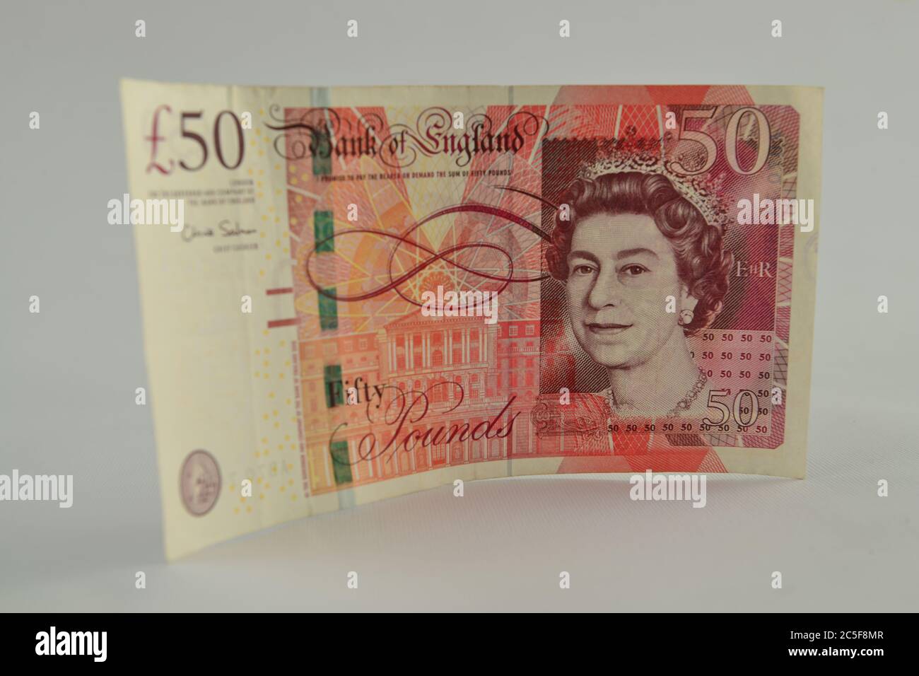 British money Fifty pound note on a white background Stock Photo - Alamy