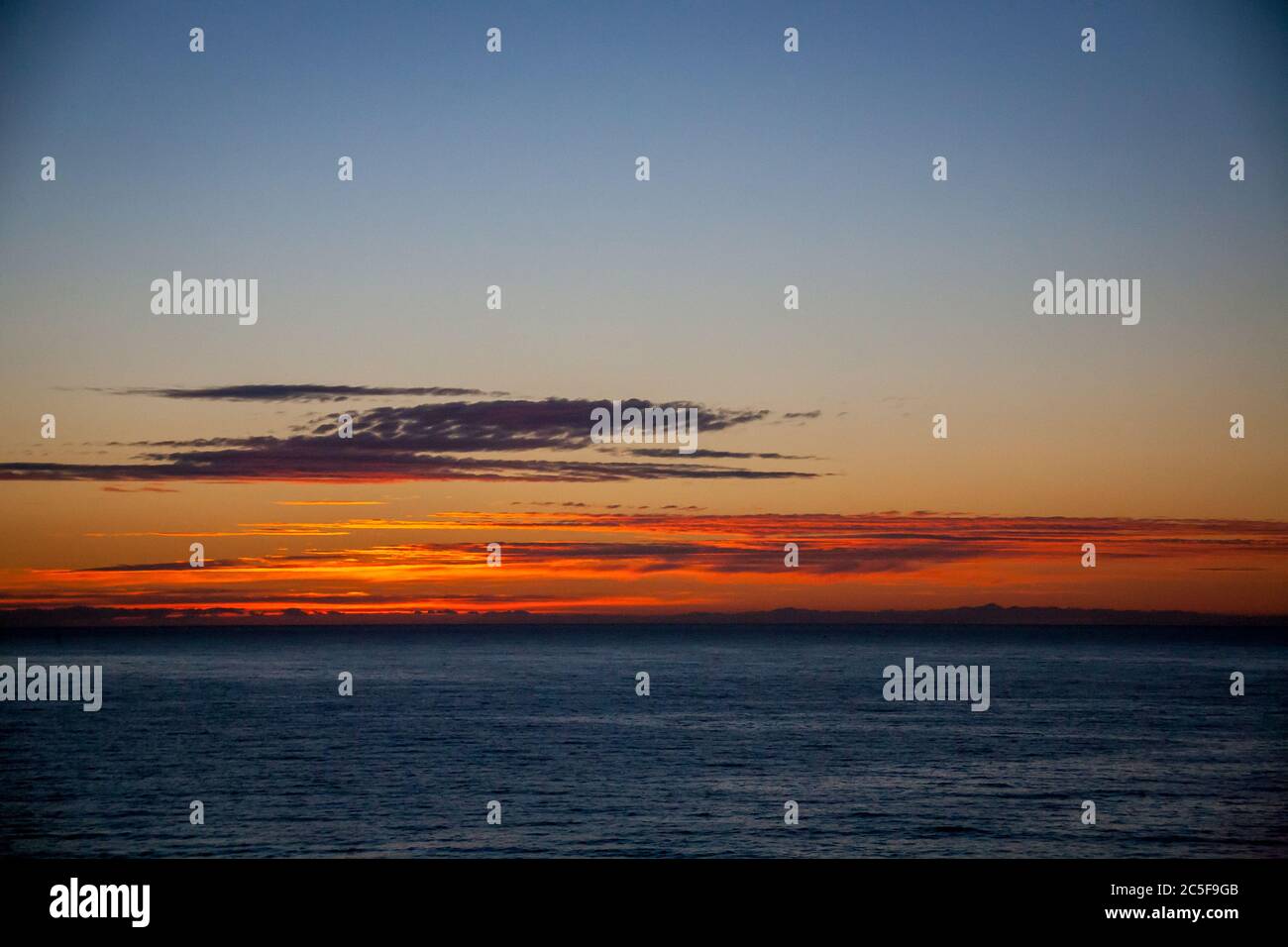 sunset over the ocean Stock Photo - Alamy