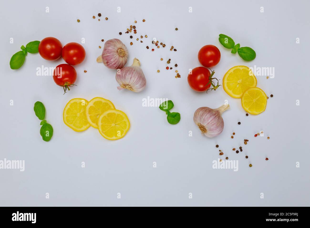 Healthy spices with lemon and tomato on white background Stock Photo ...