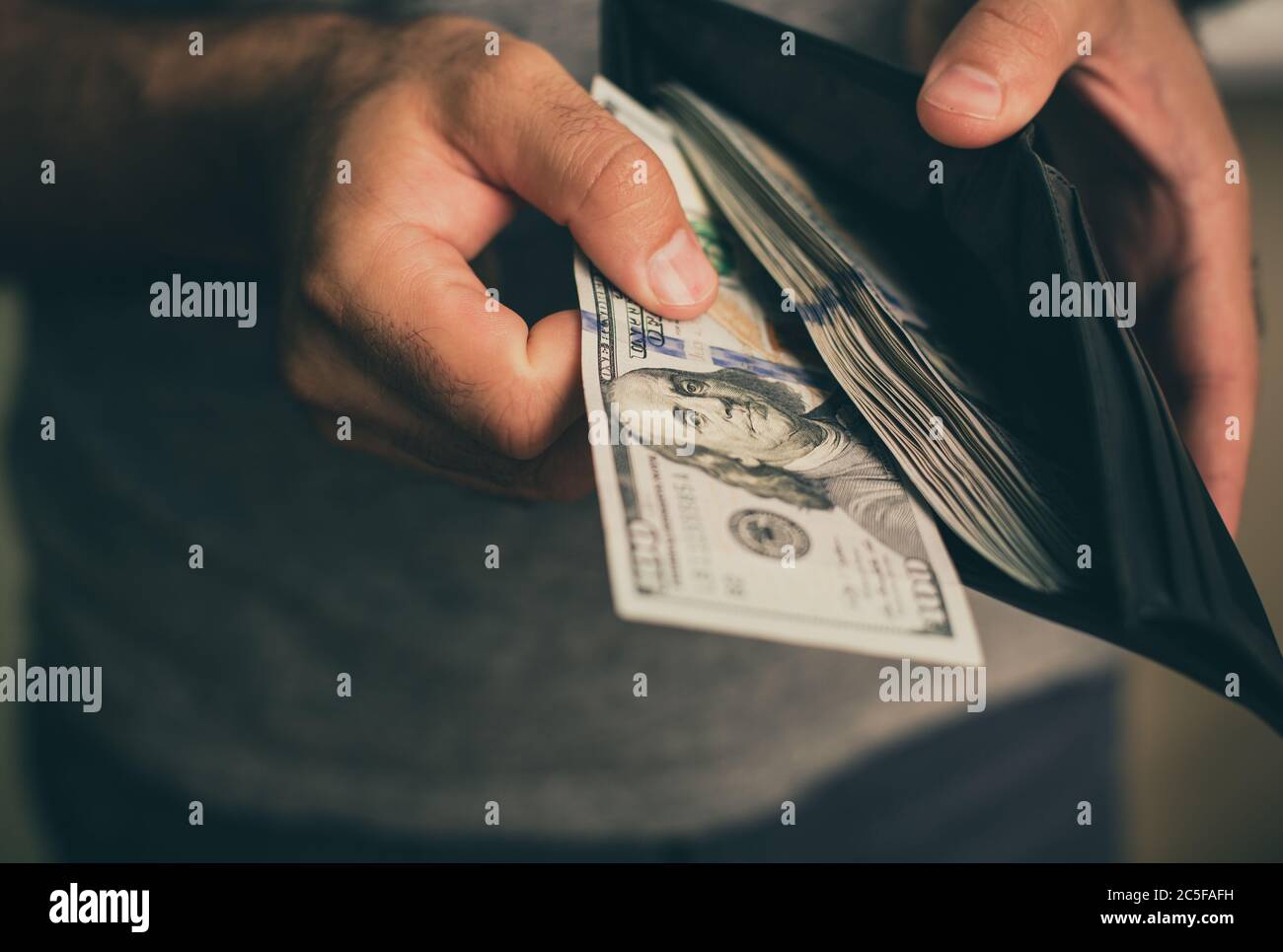 Counting money in black leather hi-res stock photography and images - Alamy