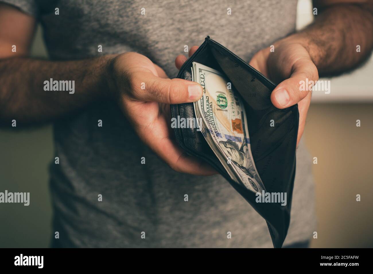 Counting money in black leather hi-res stock photography and images - Alamy