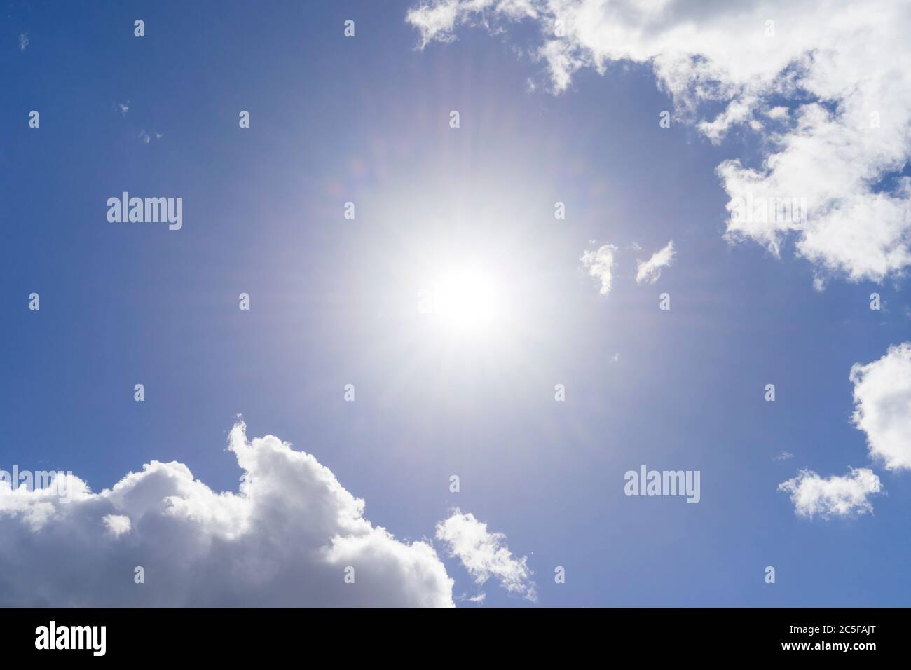 Sunny summer day with blue sky and white clouds Stock Photo - Alamy