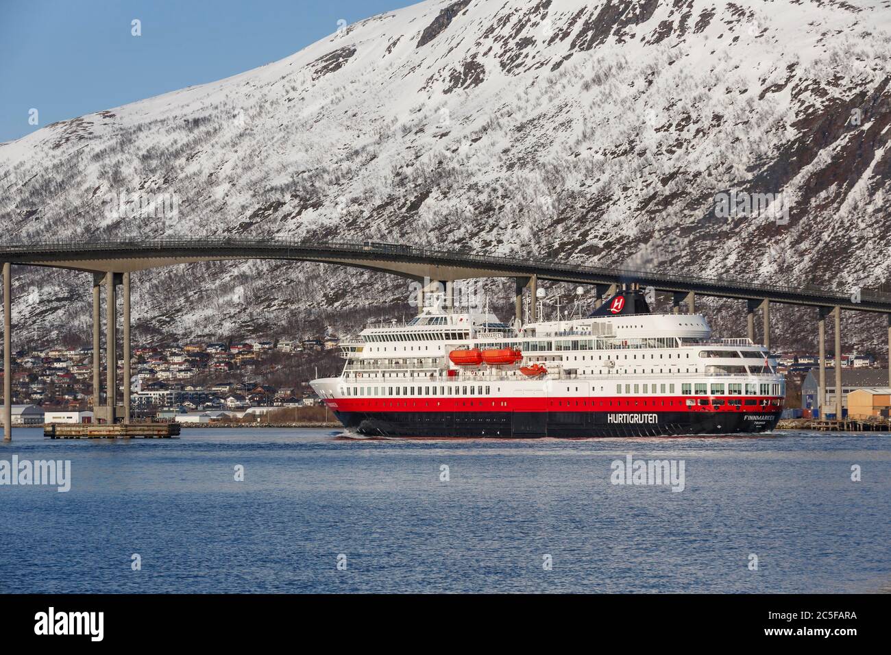 Hurtigruten vessel ms finnmarken under the tromso bridge hi-res stock ...