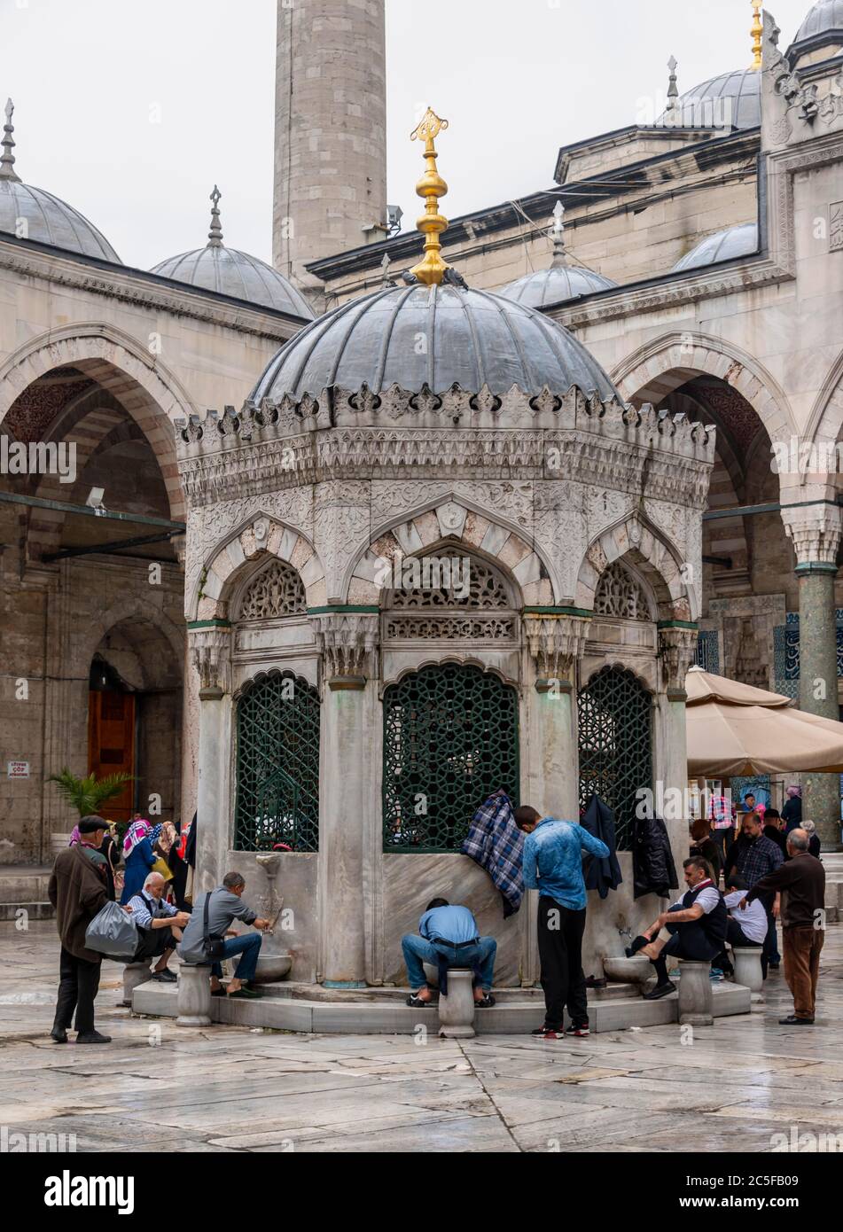 Washing ritual in front of the mosque hi-res stock photography and ...