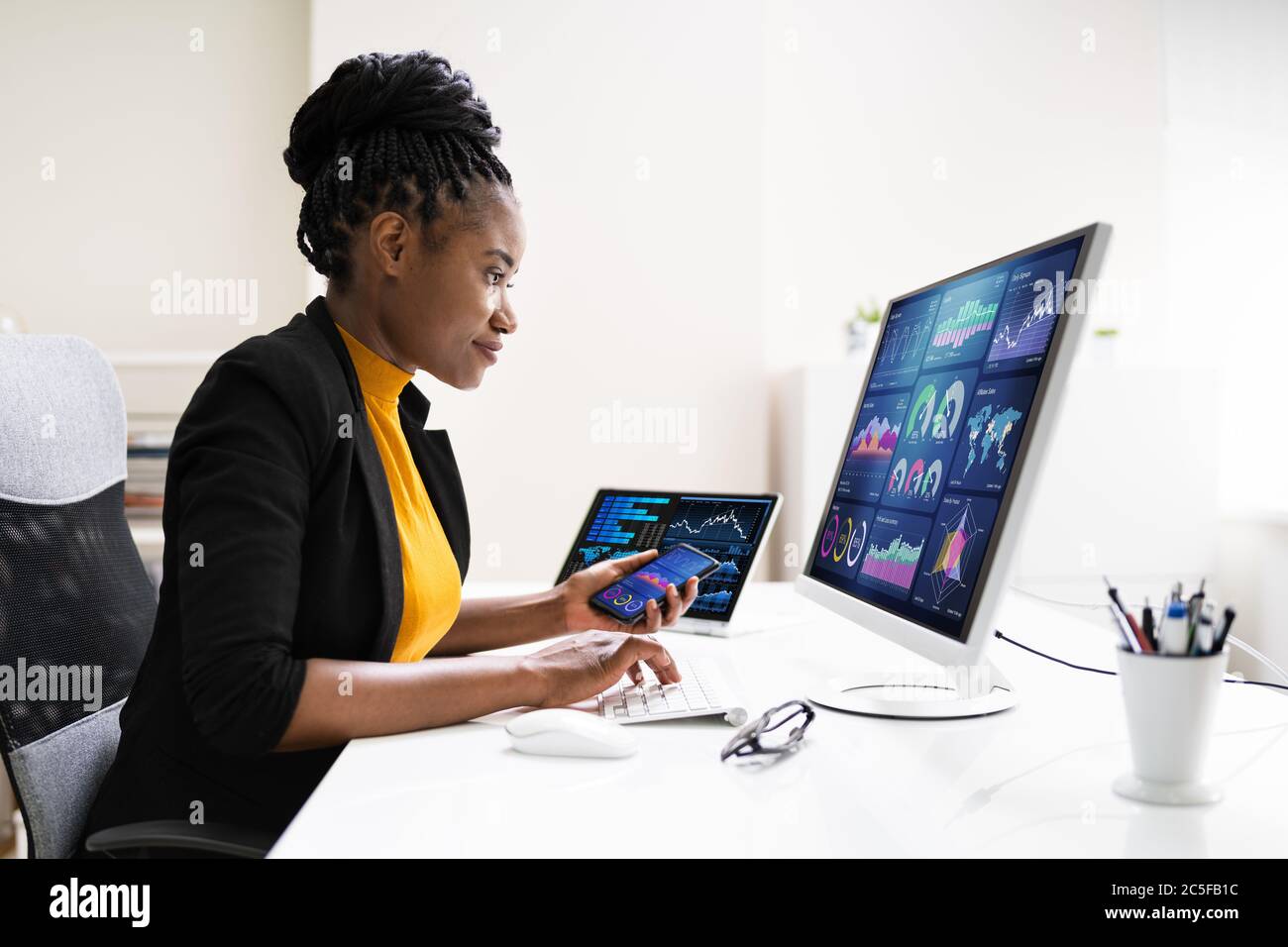 African American Business Data Analyst Woman Using Computer Stock Photo ...