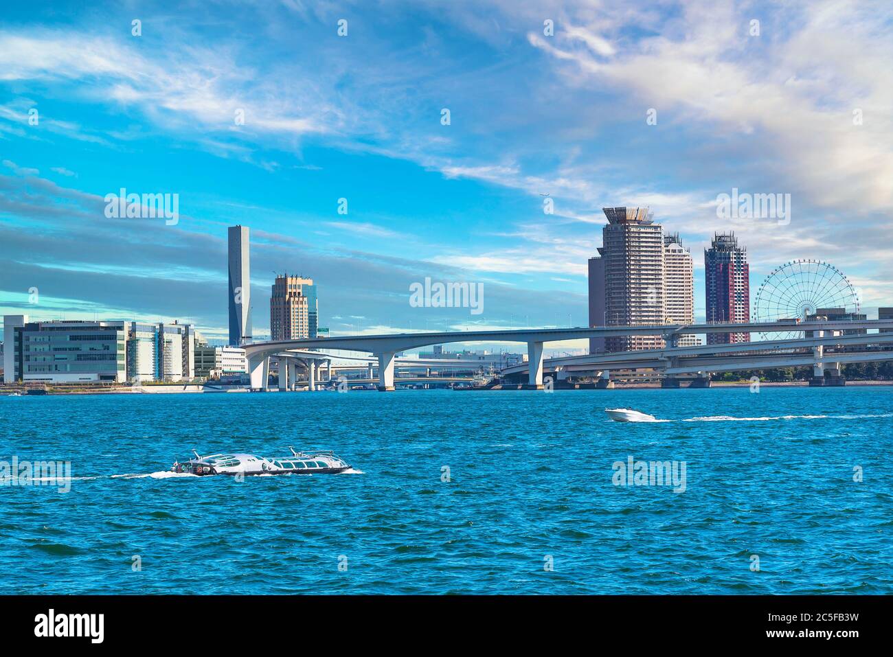 tokyo, japan - april 04 2020: Water buses sailing on Tokyo Bay in front ...