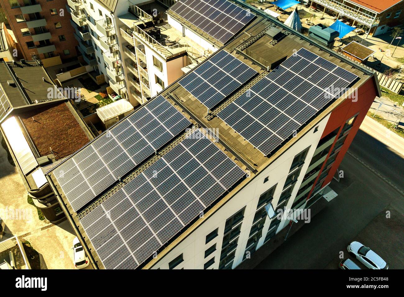 Aerial view of solar photovoltaic panels on a roof top of residential ...