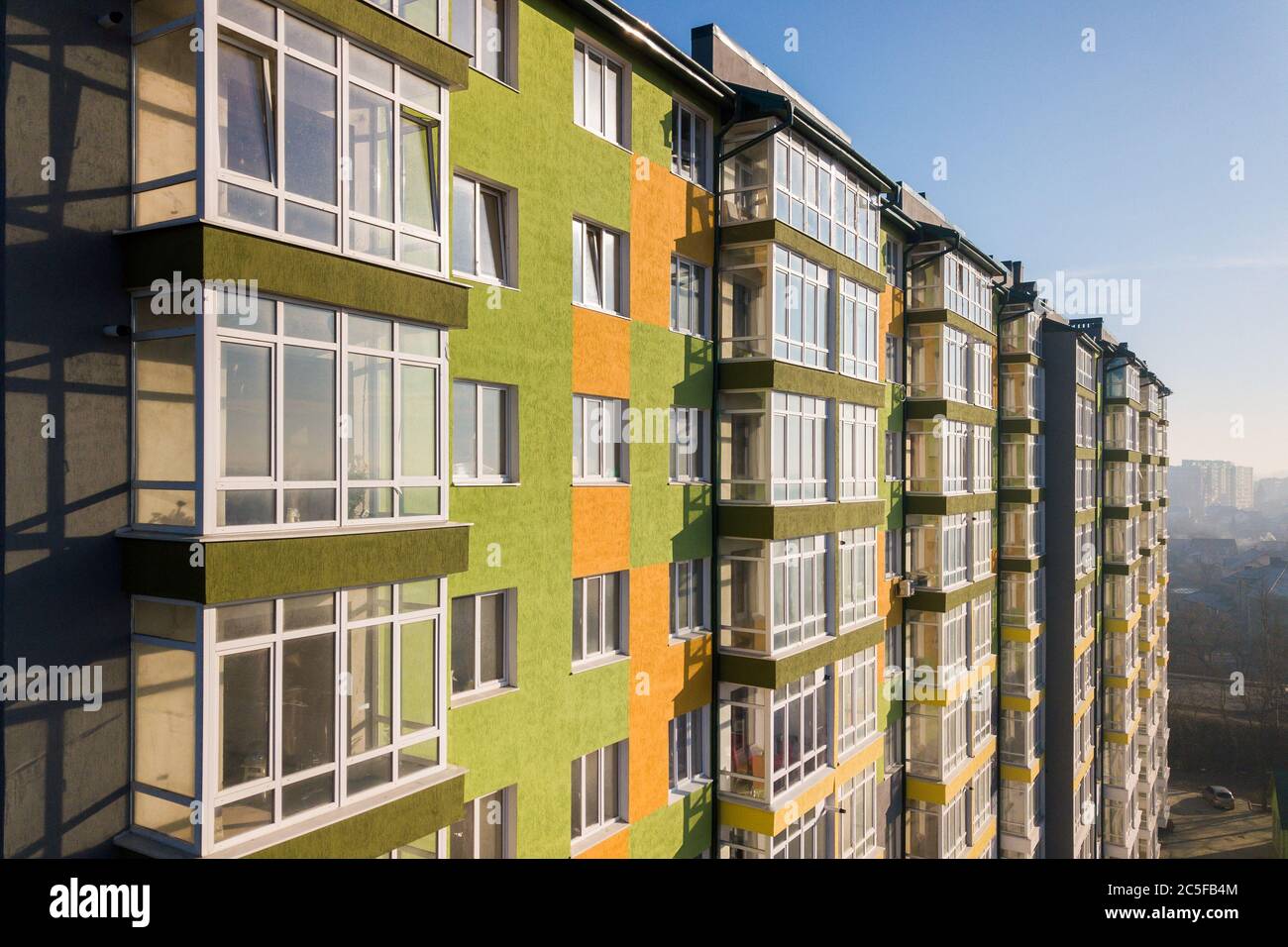 Aerial view of a tall residential apartment building with many windows ...