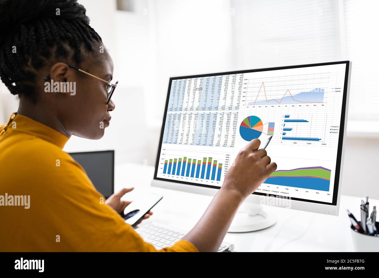 African American Business Data Analyst Woman Using Computer Stock Photo ...