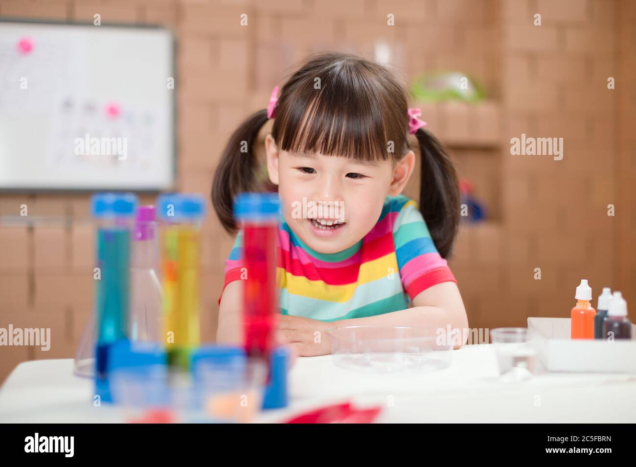 toddler girl play science experiments for homeschooling Stock Photo - Alamy