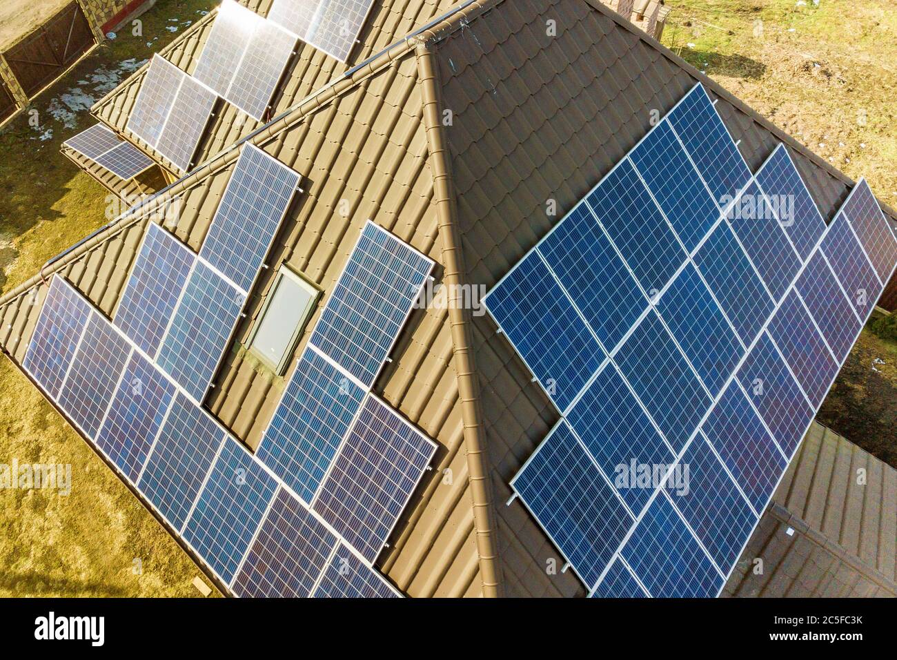 Aerial top view of new modern residential house cottage with blue shiny ...