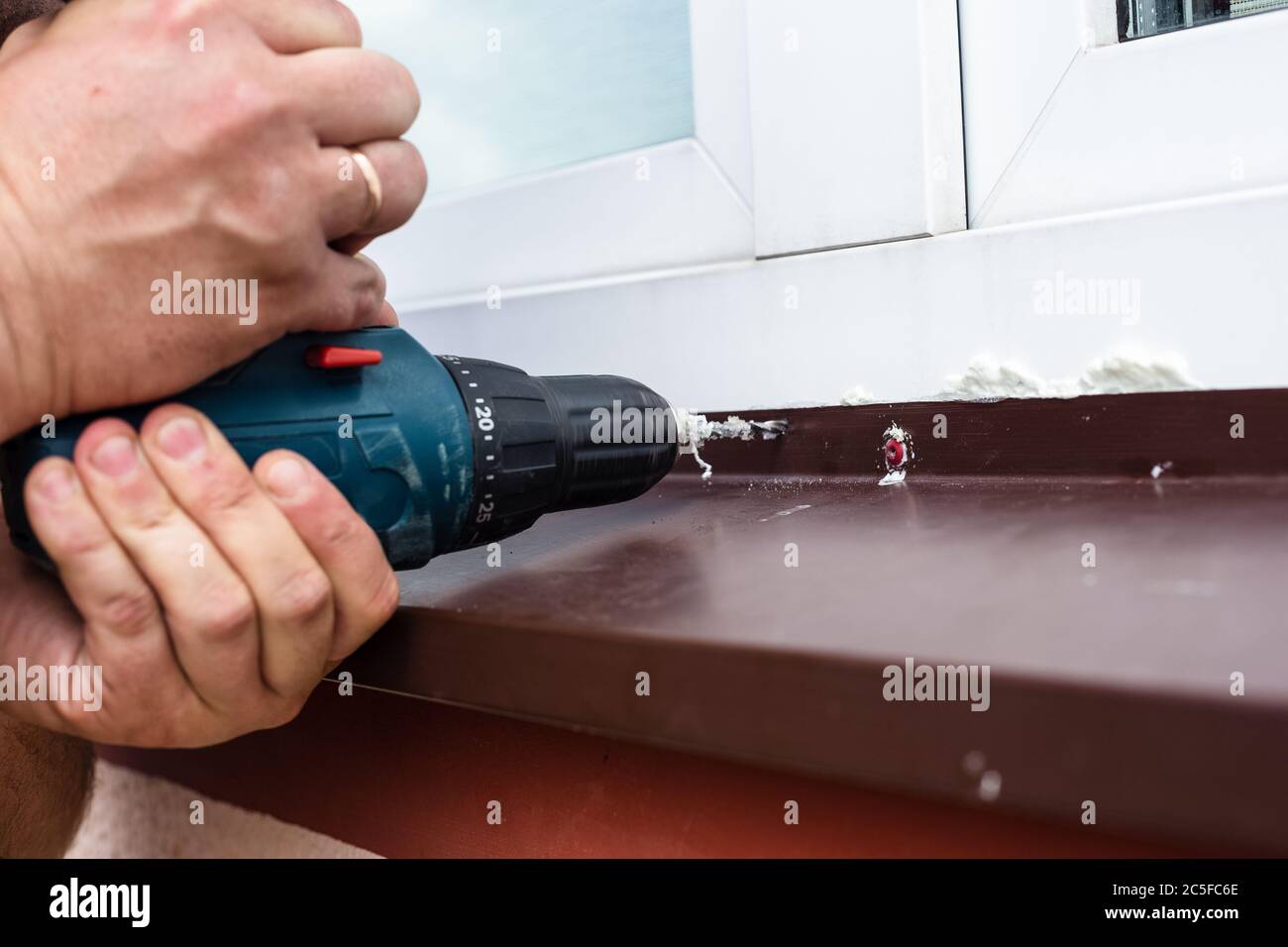 Construction work - drilling holes Stock Photo - Alamy