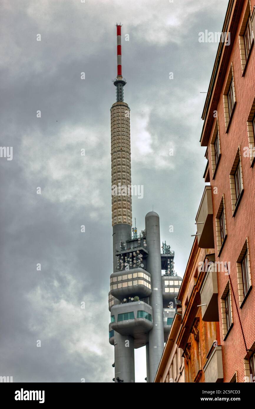 Prague Zizkov TV Tower behind old building Stock Photo - Alamy