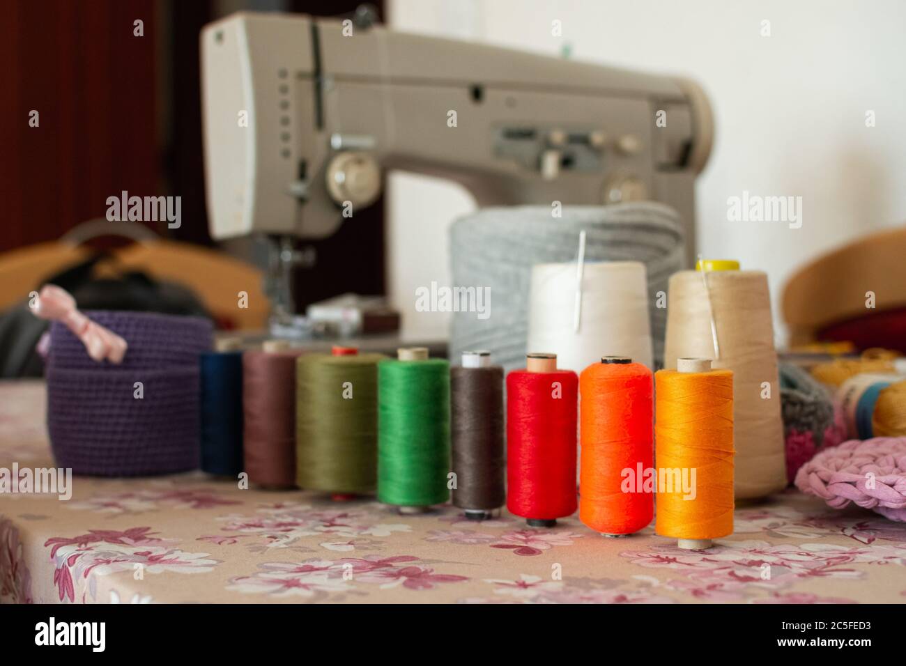Sewing machine and colorful threads Stock Photo - Alamy