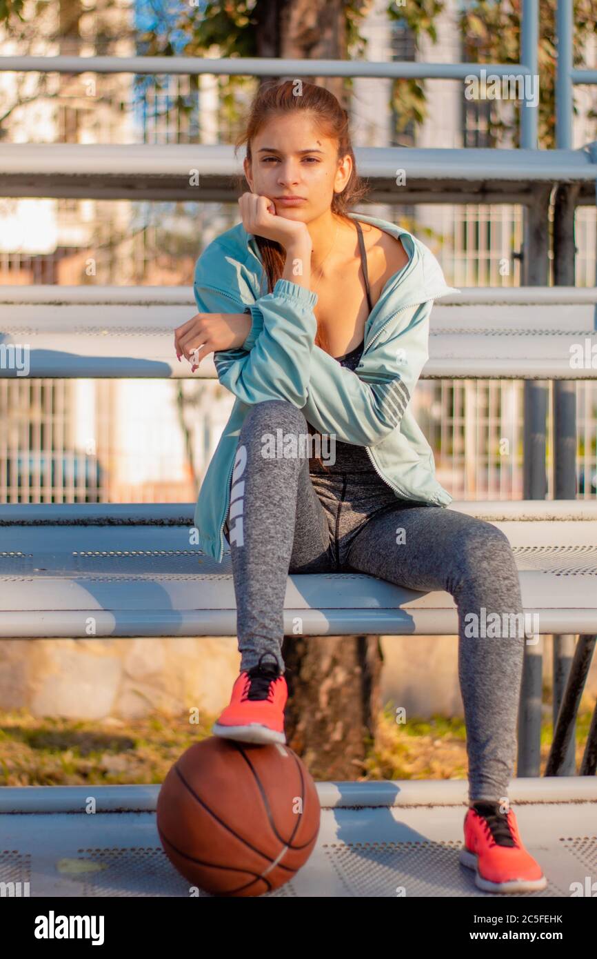 Mexican fitness girl watching a ball match Stock Photo - Alamy
